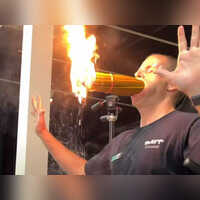Man fights back saliva to hold 150 burning candles in his mouth for ...