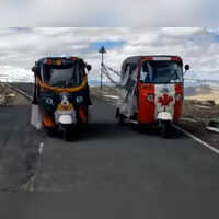 Auto rickshaws drive on Umling La Pass, the highest motorable road, to ...