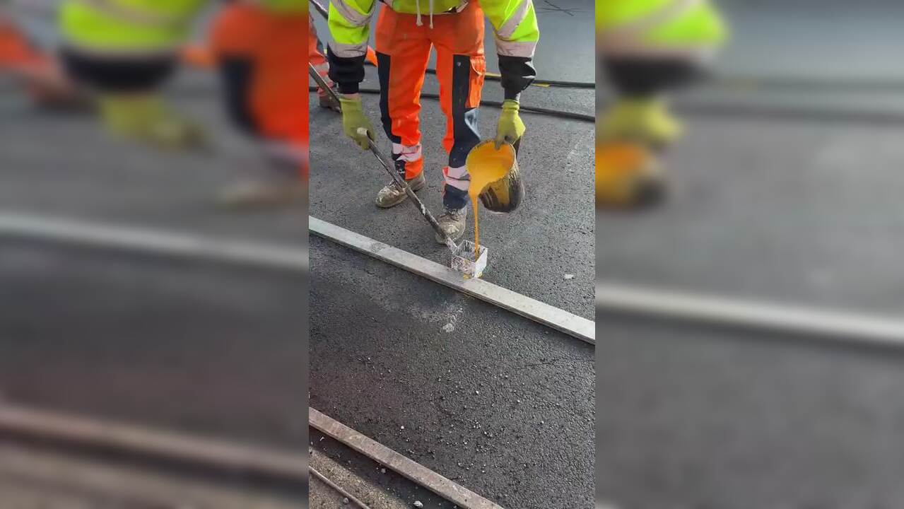 Road Slide Art: Clip Showing How Smoothly Painters Write Large Letters ...