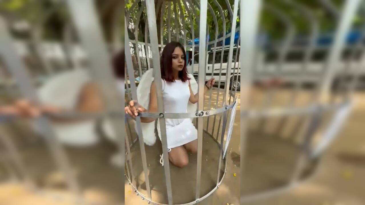 PETA India Activist Locks Herself In a Cage to Protest Bird Captivity ...