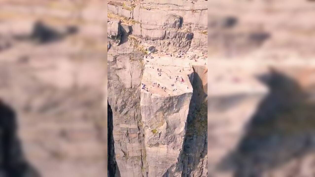 Viral Video: Norway Tourists Lounge On Edge Of Cliff With 2,000-Foot Drop | Viral Videos News ...
