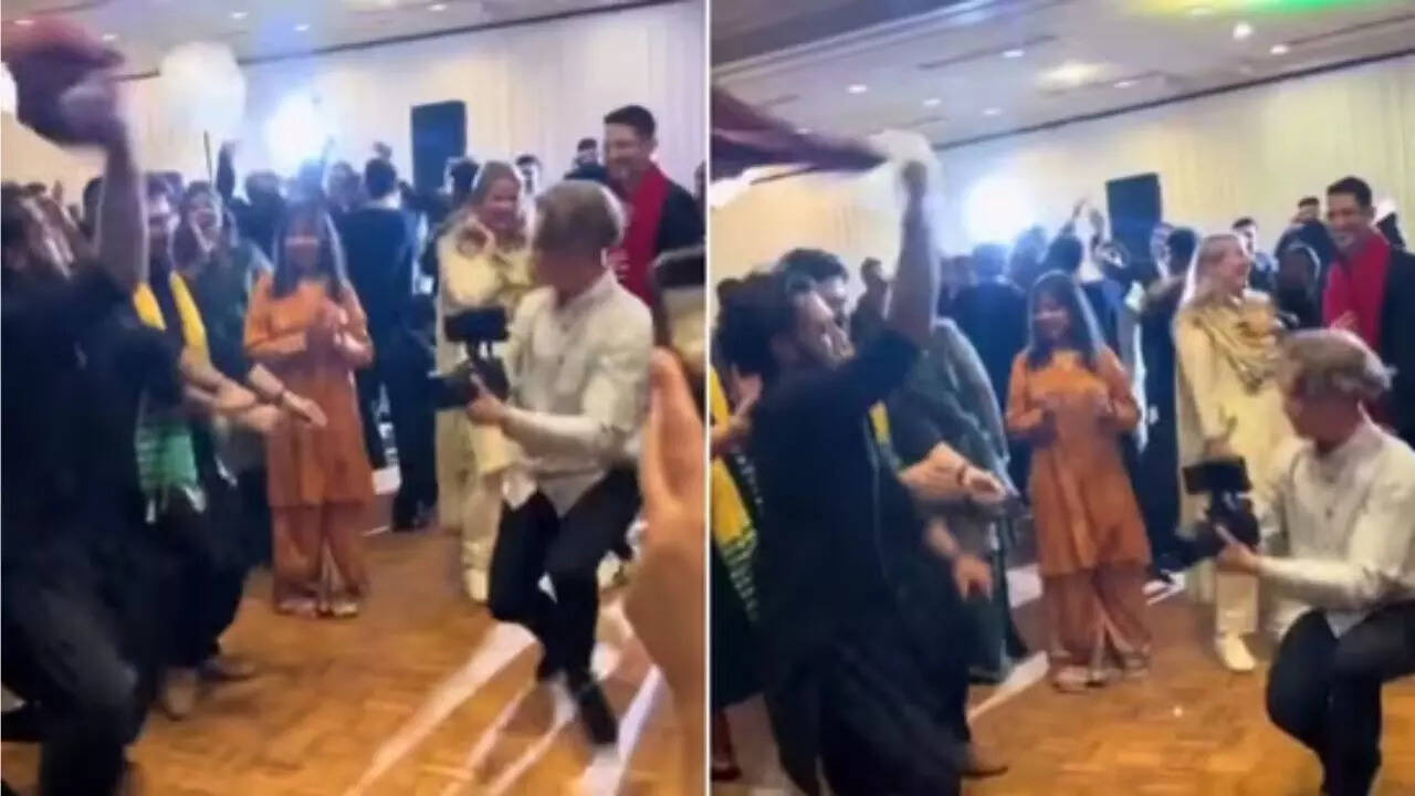 Wedding Photographer Breaks Into Impromptu Dance With Guests While ...