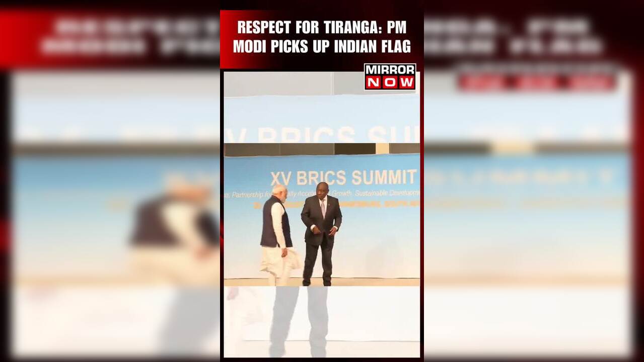 PM Modi Picks Up Indian Flag On The Floor At BRICS Summit, South ... PM Modi Picks Up Indian Flag On The Floor At BRICS Summit, South ...