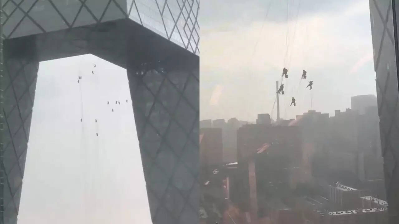 China: Beijing Skyscraper Window Cleaners Stranded Mid-Air Amid Storm ...