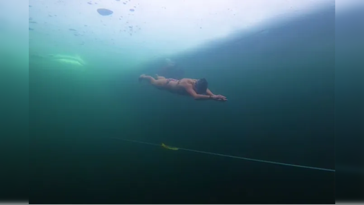 Woman sets new Guinness World Record by swimming nearly 300 feet under ...