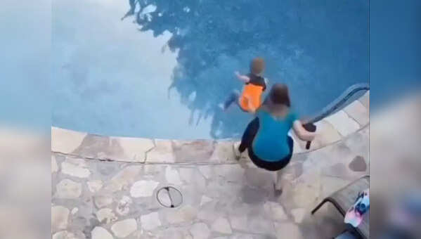 Viral video: Mother catches son jumping into swimming pool mid-air with ...