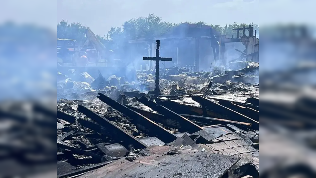 Lone cross remains standing after fire burns church to the ground ...