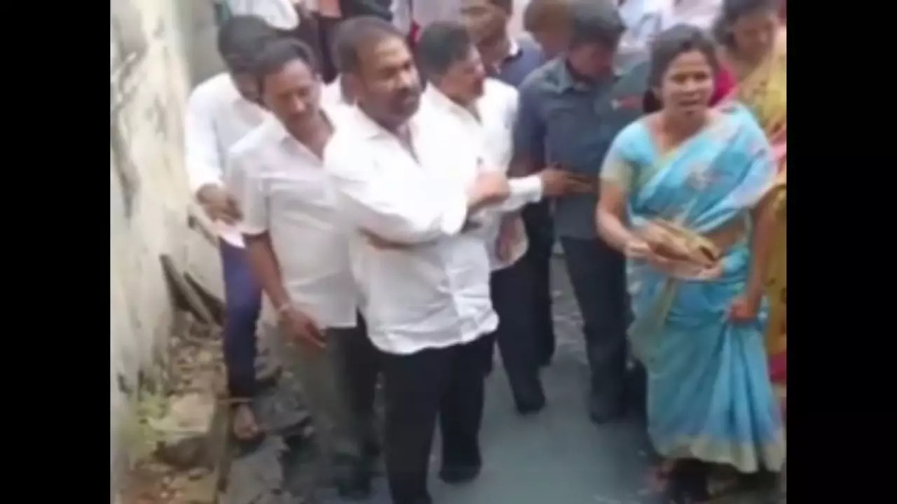 Andhra Pradesh: YSRCP MLA Sridhar Reddy stands in overflowing drain to ...
