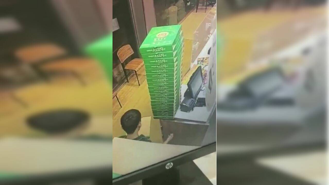 Viral video: Restaurant employee catches pizza box falling off pile ...