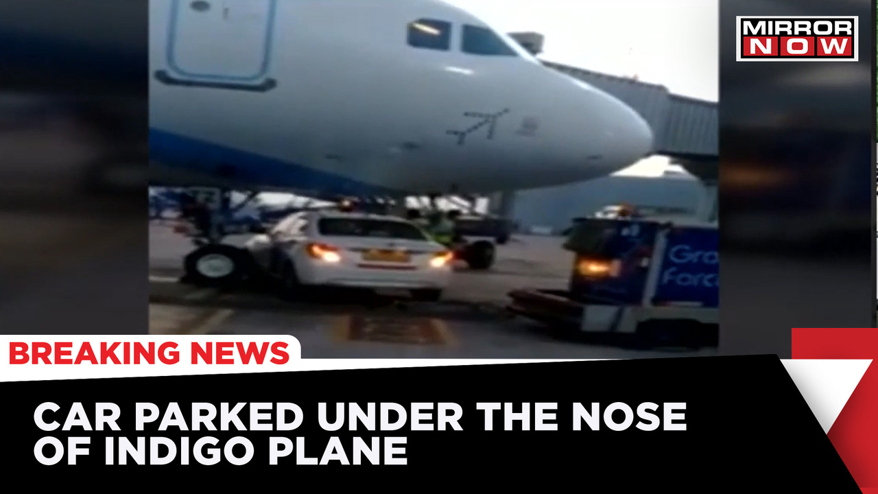 Car Parked Under The Nose Of Indigo Aircraft At Delhi International ...