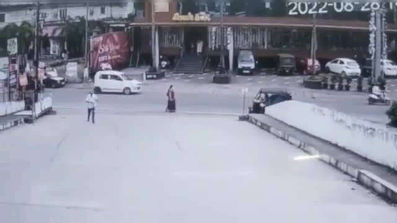 Viral video: Woman walking on road has miraculous escape as car rams ...