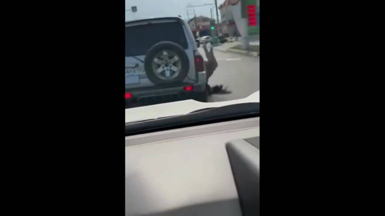 Viral video: Woman dancing out of moving car's window falls headfirst ...