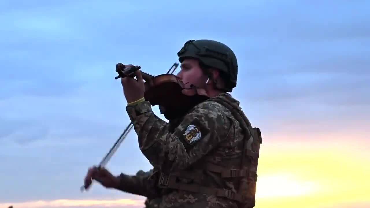 Viral video: Ukrainian street musician in army plays violin on the ...