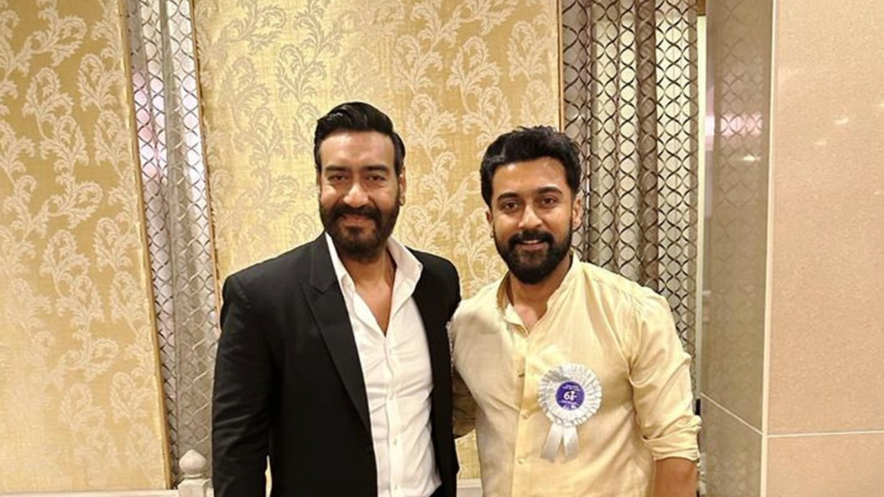 Ajay Devgn strikes a pose with fellow National Award Winner Suriya ...
