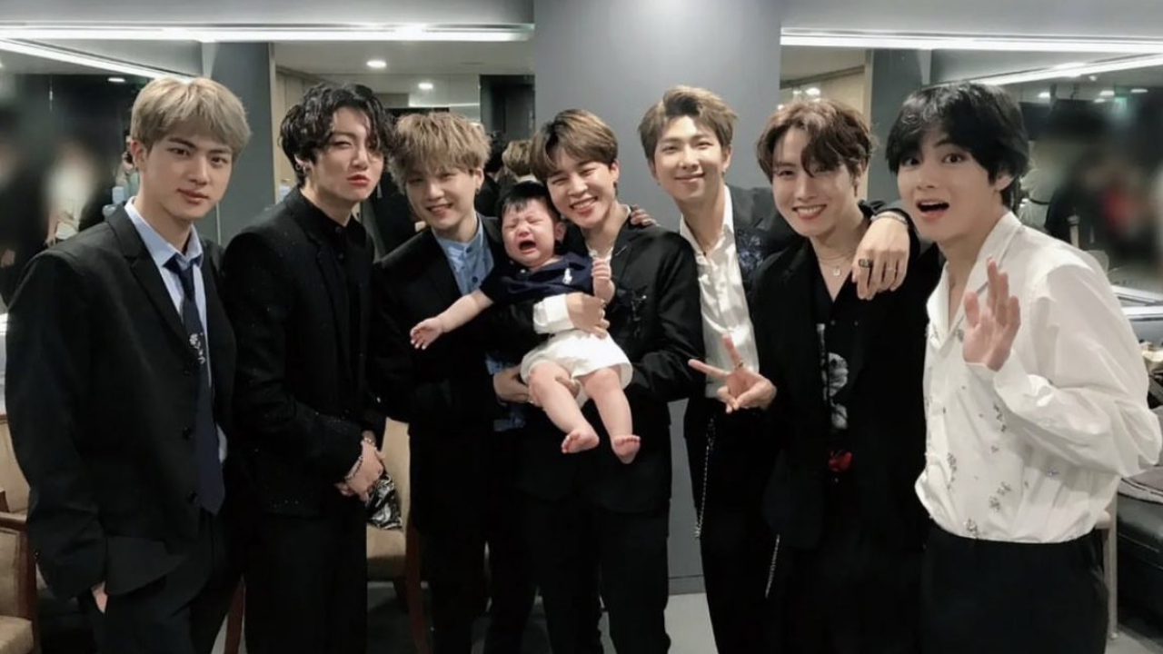 BTS look adorable cuddling their manager's baby in Instagram post; ARMY ...