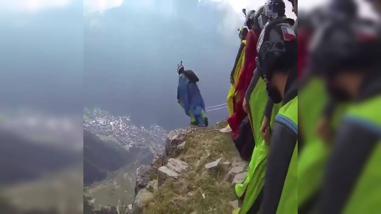 Wingsuit divers jump off cliff one by one; final jumper captures bird ...