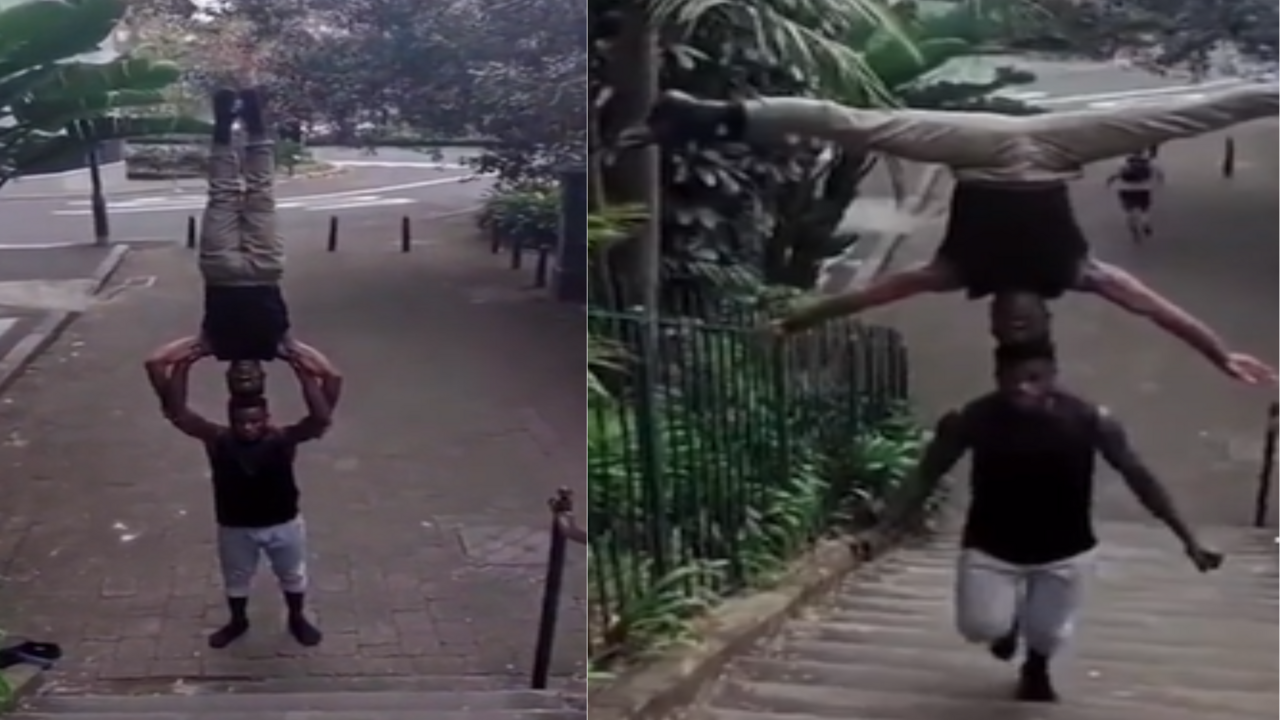 Viral video: Man climbing stairs while balancing another upside-down on ...