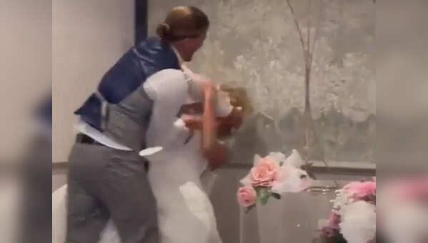 Viral video of groom 'aggressively' smashing wedding cake in bride's ...