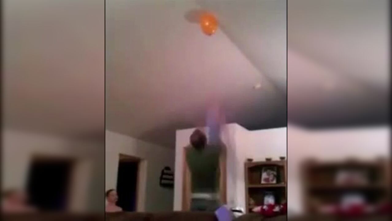 Viral Video: Dad throws son up in air to fetch balloon stuck on ceiling ...