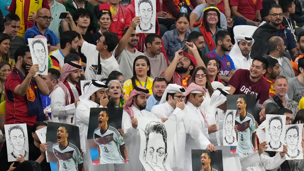 Qatar fans hit back at Germany's mouth covering protest with Mesut Ozil ... Qatar fans hit back at Germany's mouth covering protest with Mesut Ozil ...