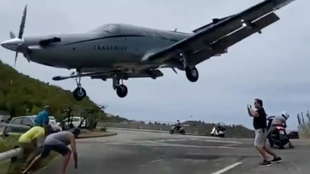 Viral video: People duck as plane passes overhead to land at world's ...