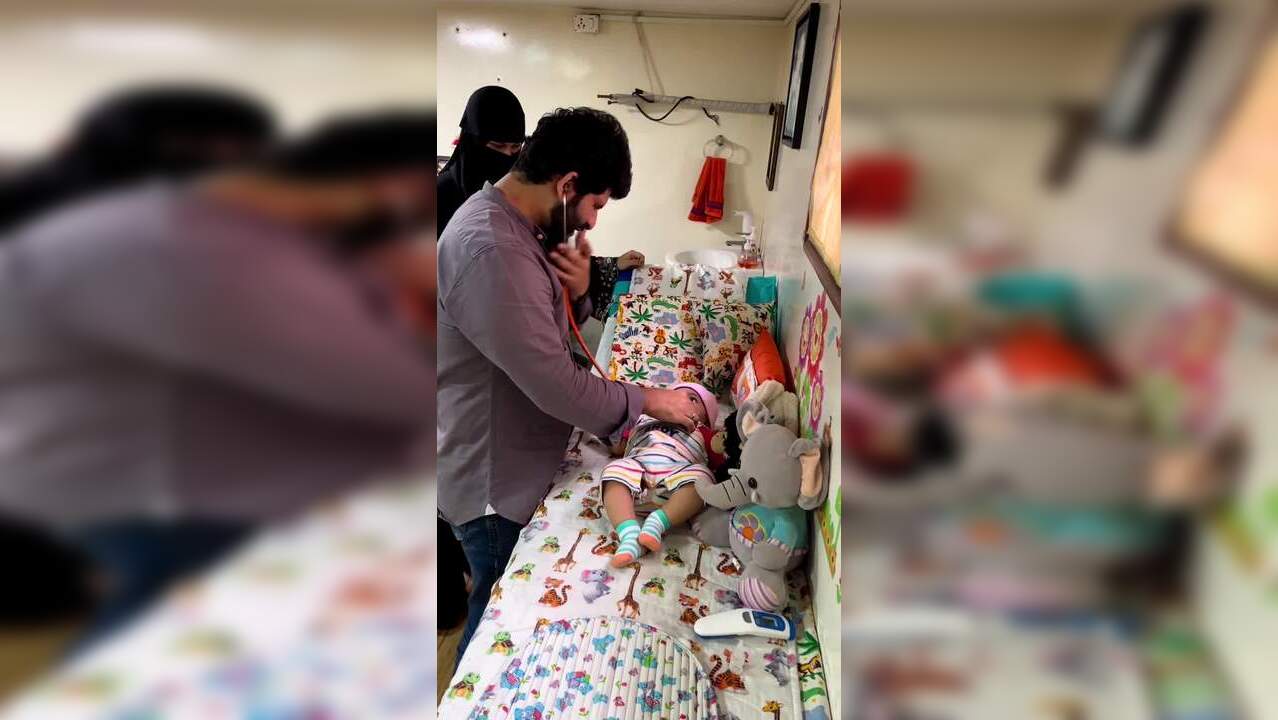 Viral video: Doctor distracts baby while giving vaccination shot ...