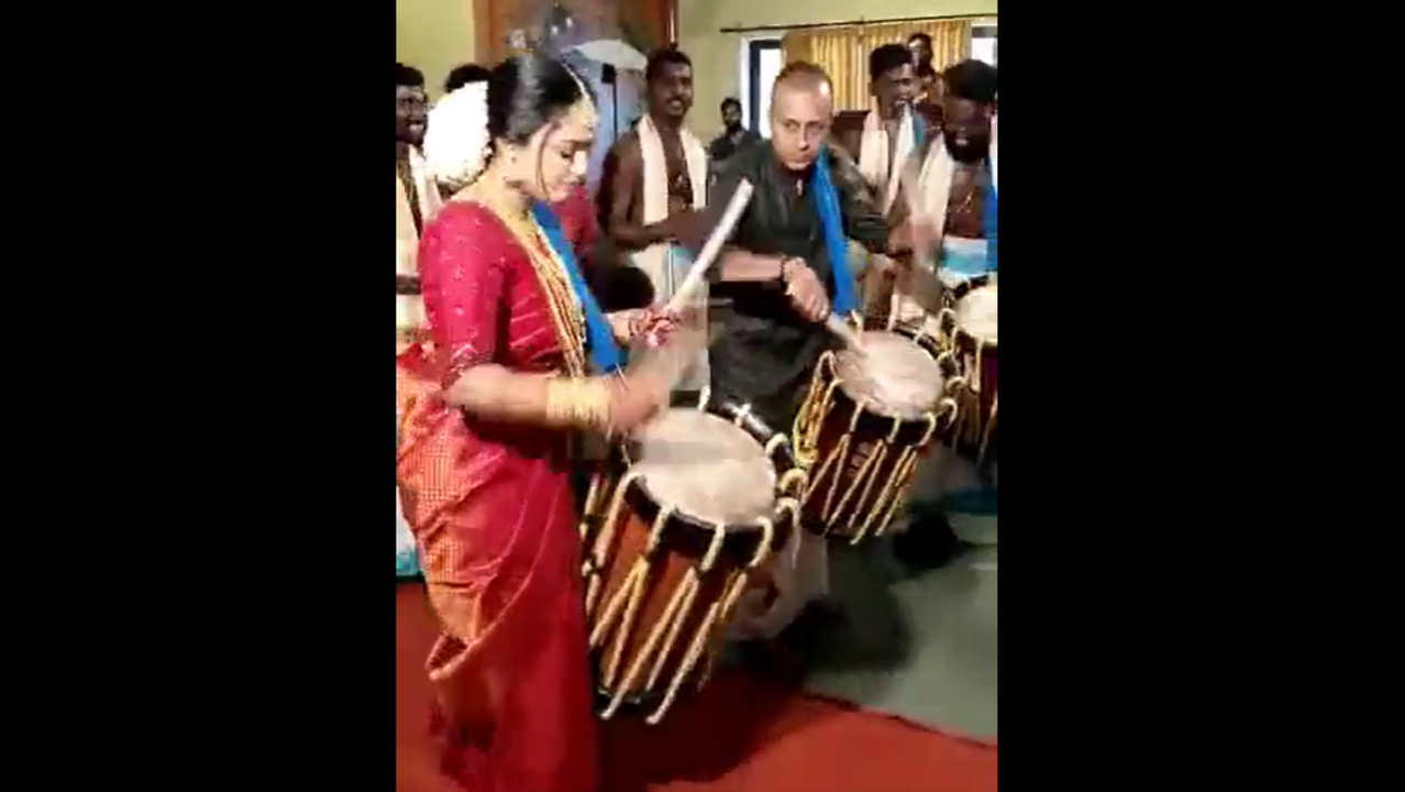 Bride plays the chenda in temple on her wedding, her 'master' father ...