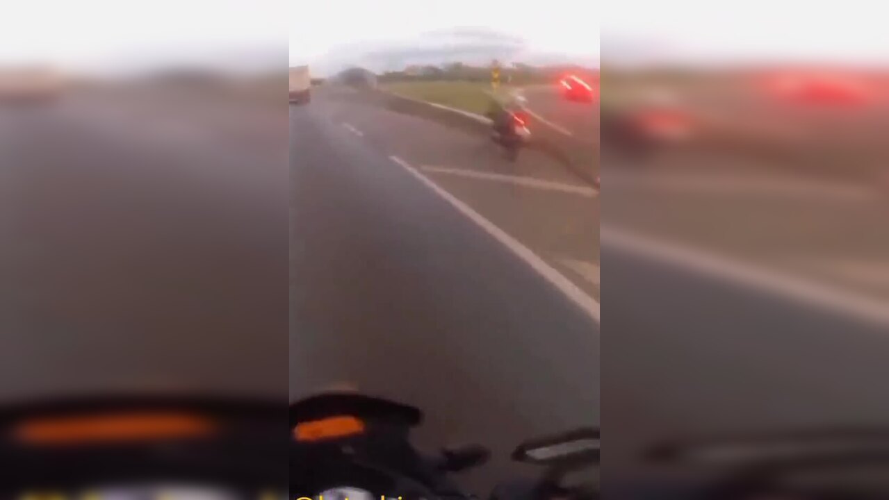 Caught on camera: Biker ‘disappears’ after being hit by flying tyre in ... Caught on camera: Biker ‘disappears’ after being hit by flying tyre in ...