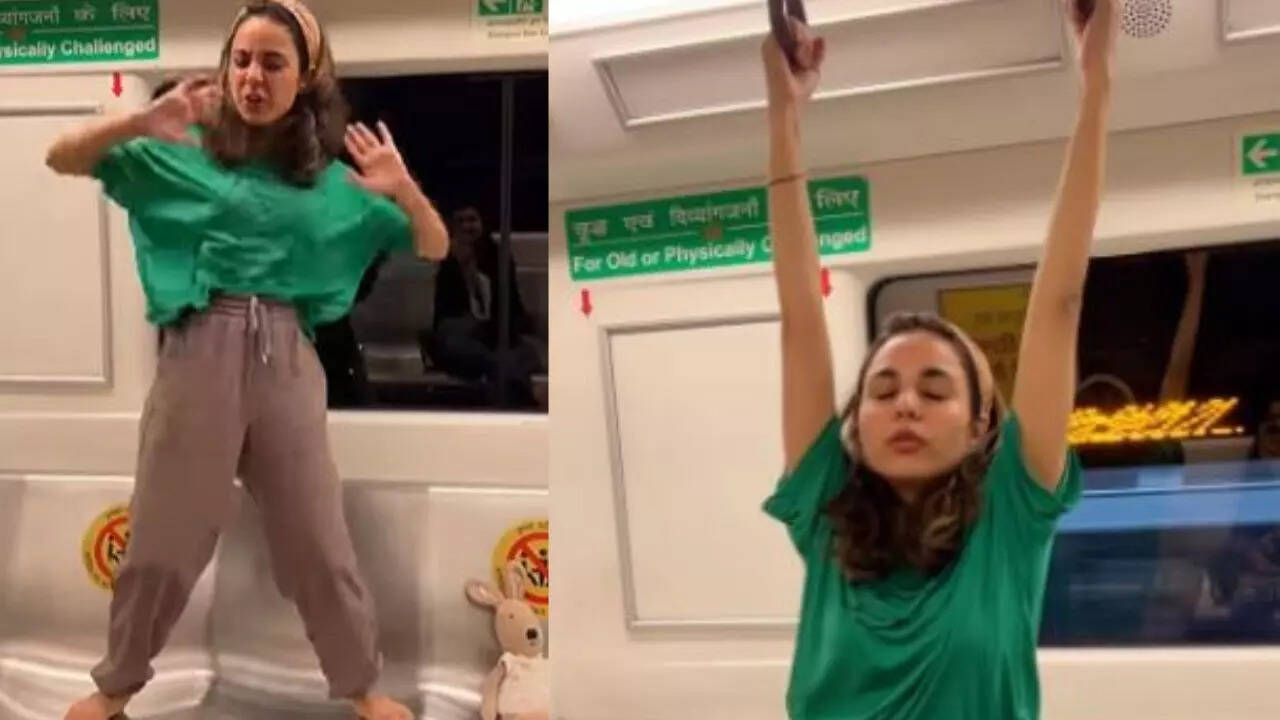 Woman dances on seat, swings on handrails in empty metro coach ...