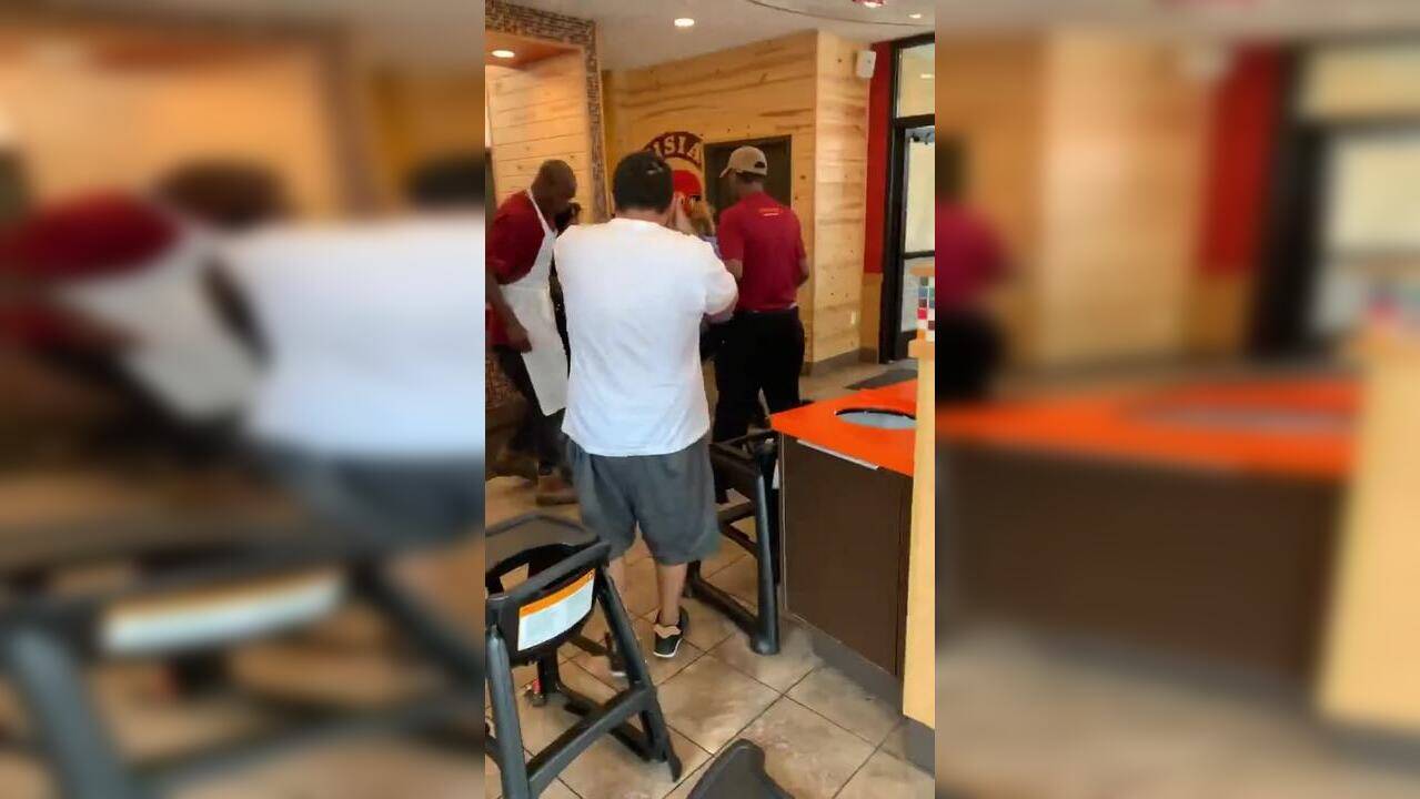 Viral video | Female employees of fast-food restaurant drag customer by ...