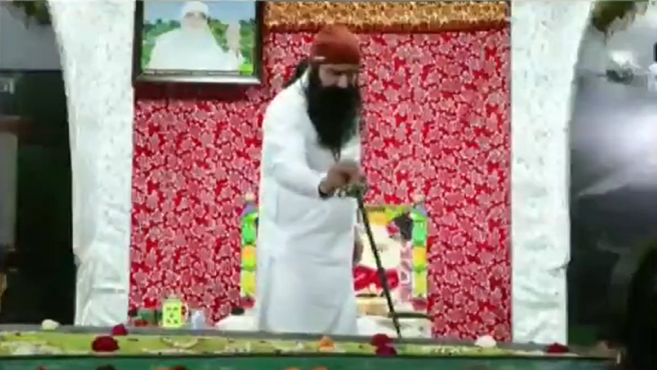 WATCH - Rape convict Ram Rahim cuts cake with sword after being ...