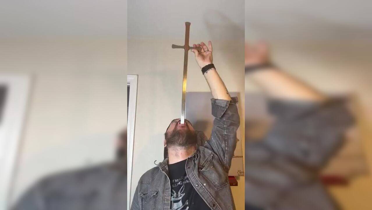 Viral video: Man shows trick to ‘swallow’ sword whole | Times Now