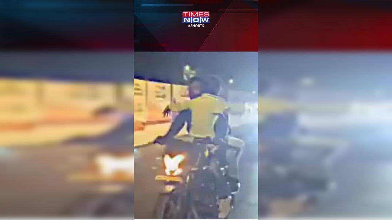 A Video Of A Man Performing A Dangerous Bike Stunt With Two Girls Goes ...