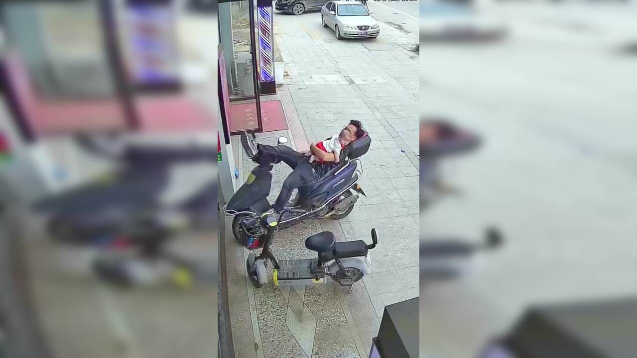 'Father of the year': Man Falls Off Scooter, Stunning Reflexes Makes ...